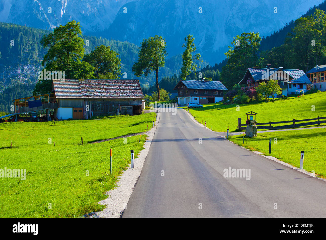 Alps village and road landscape Stock Photo - Alamy