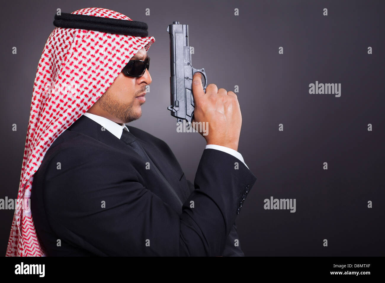 Arabic man holding a gun hi-res stock photography and images - Alamy