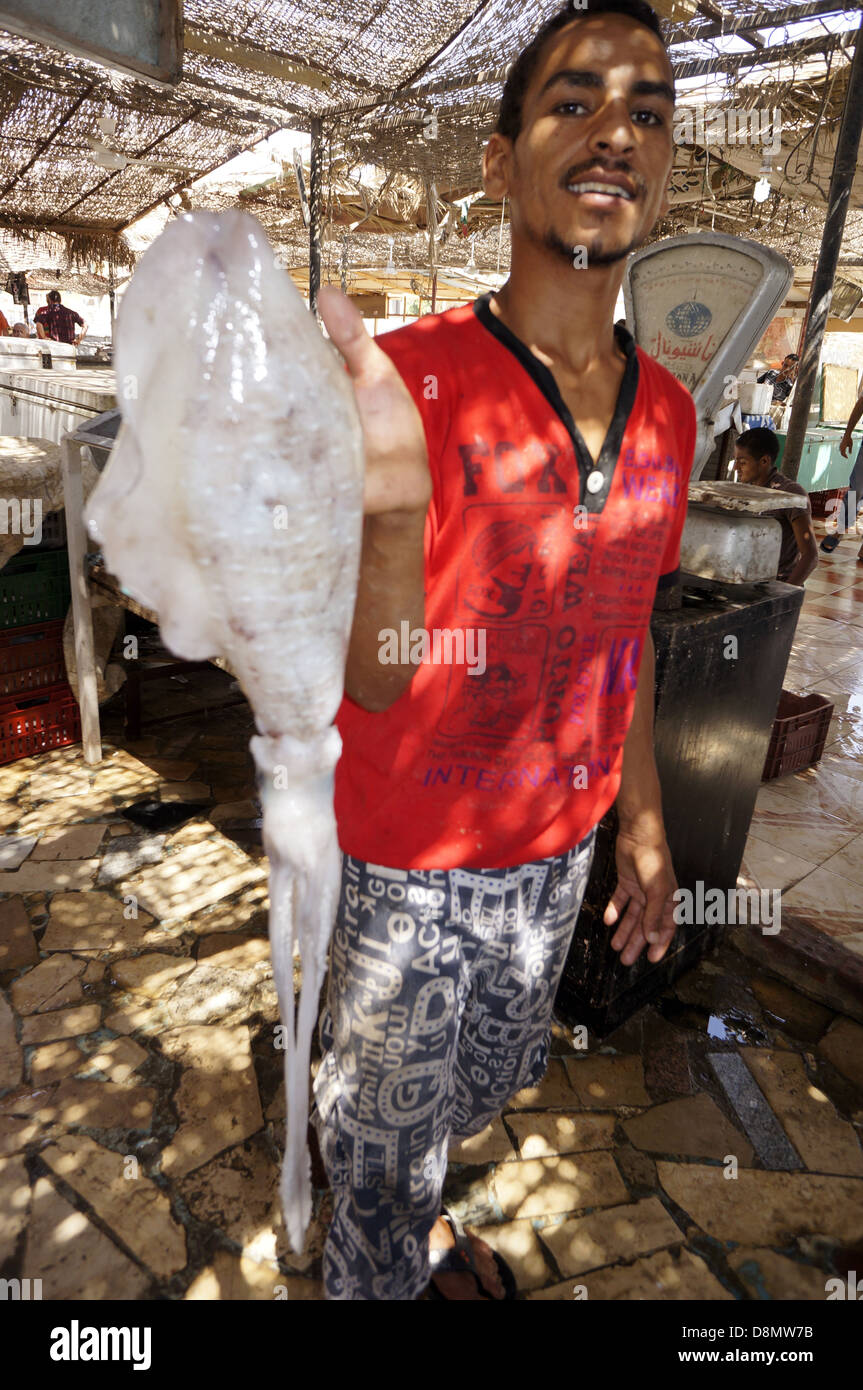fishmonger on the fish market Stock Photo - Alamy