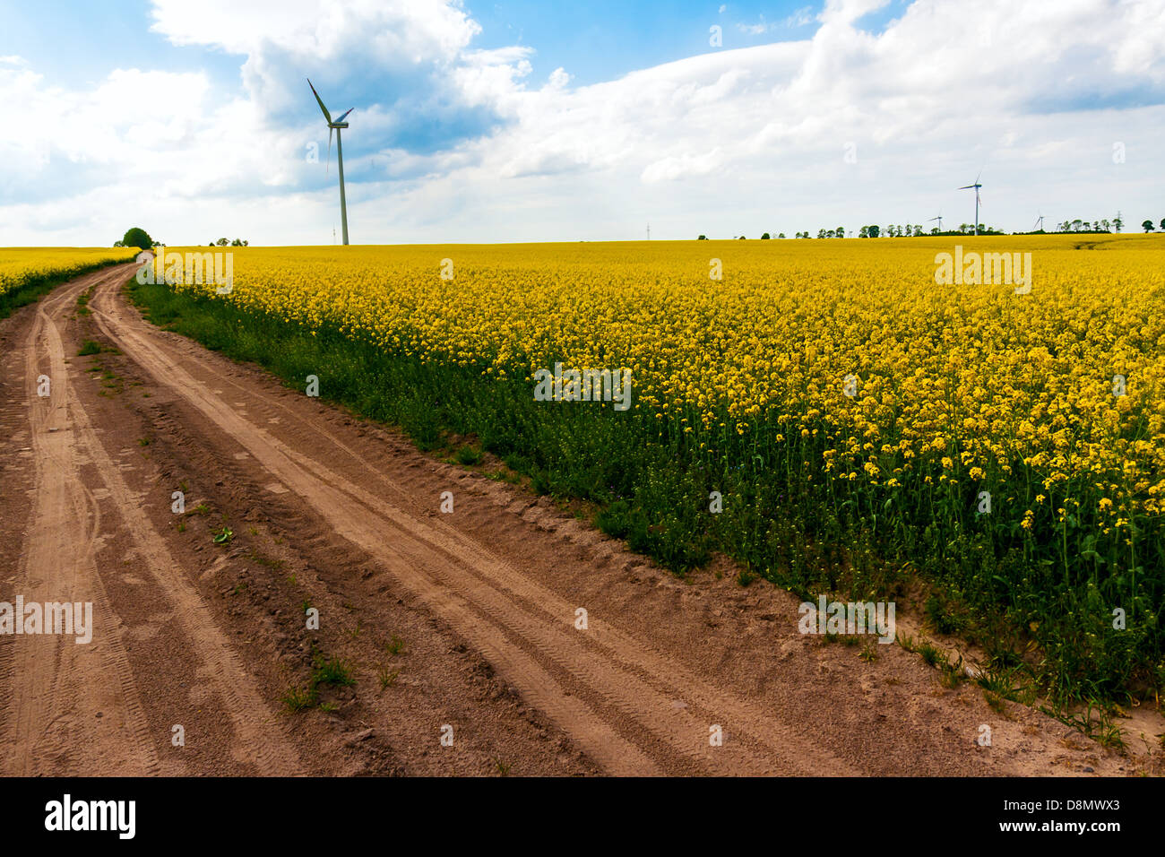 Summer landscape with energy wind turbines farm and road Stock Photo ...