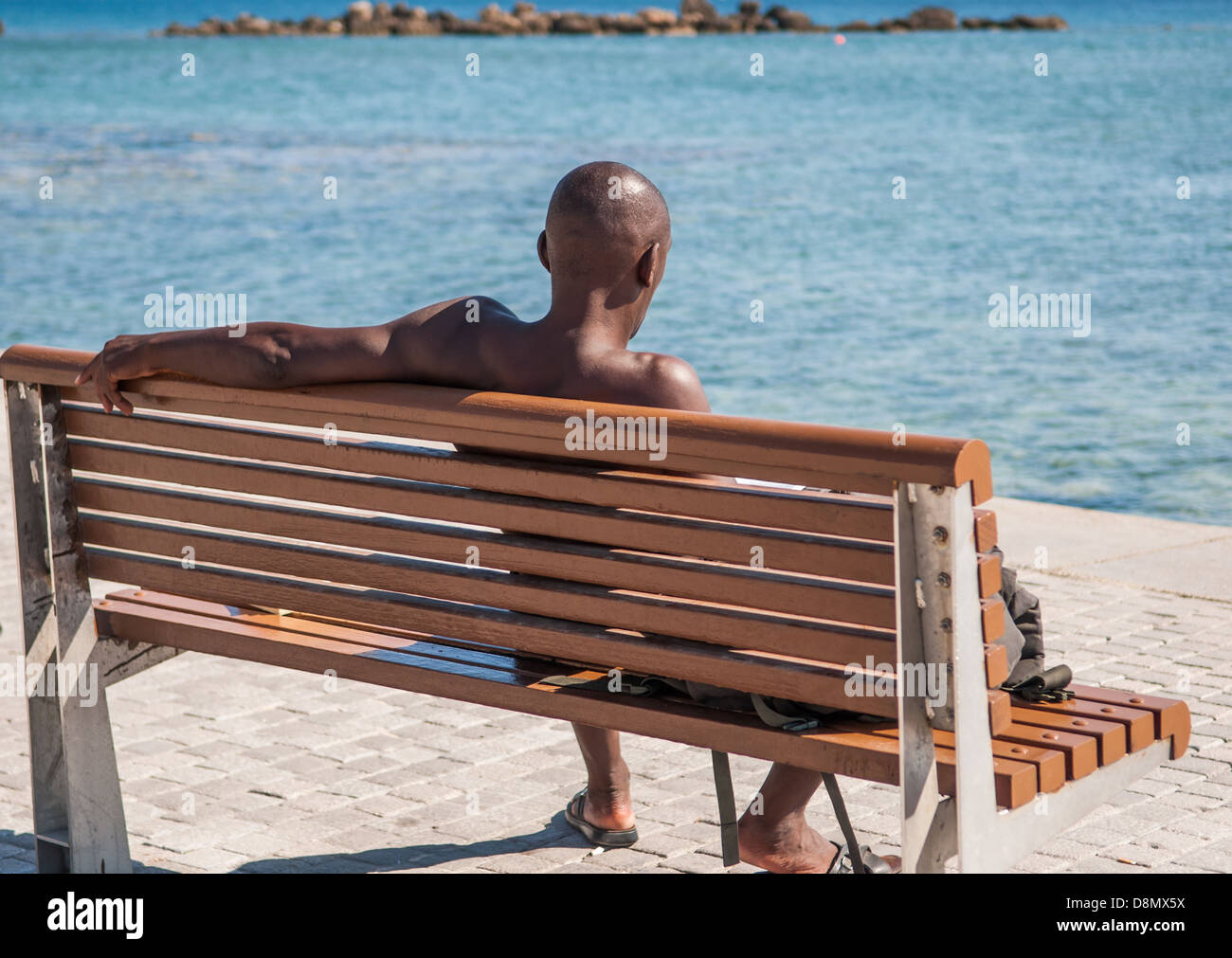 man sitting on a bench with his back Stock Photo - Alamy