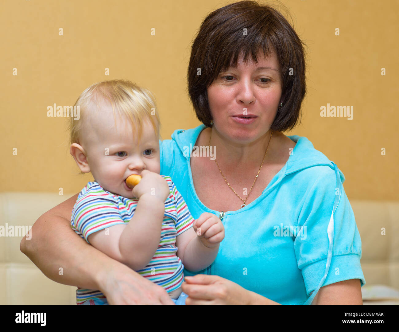 Grandma holds the newborn grandson Stock Photo - Alamy