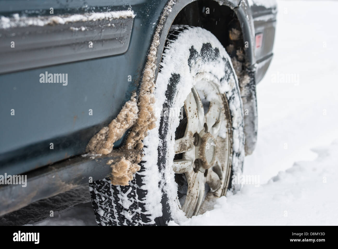 wheel in the snow Stock Photo - Alamy