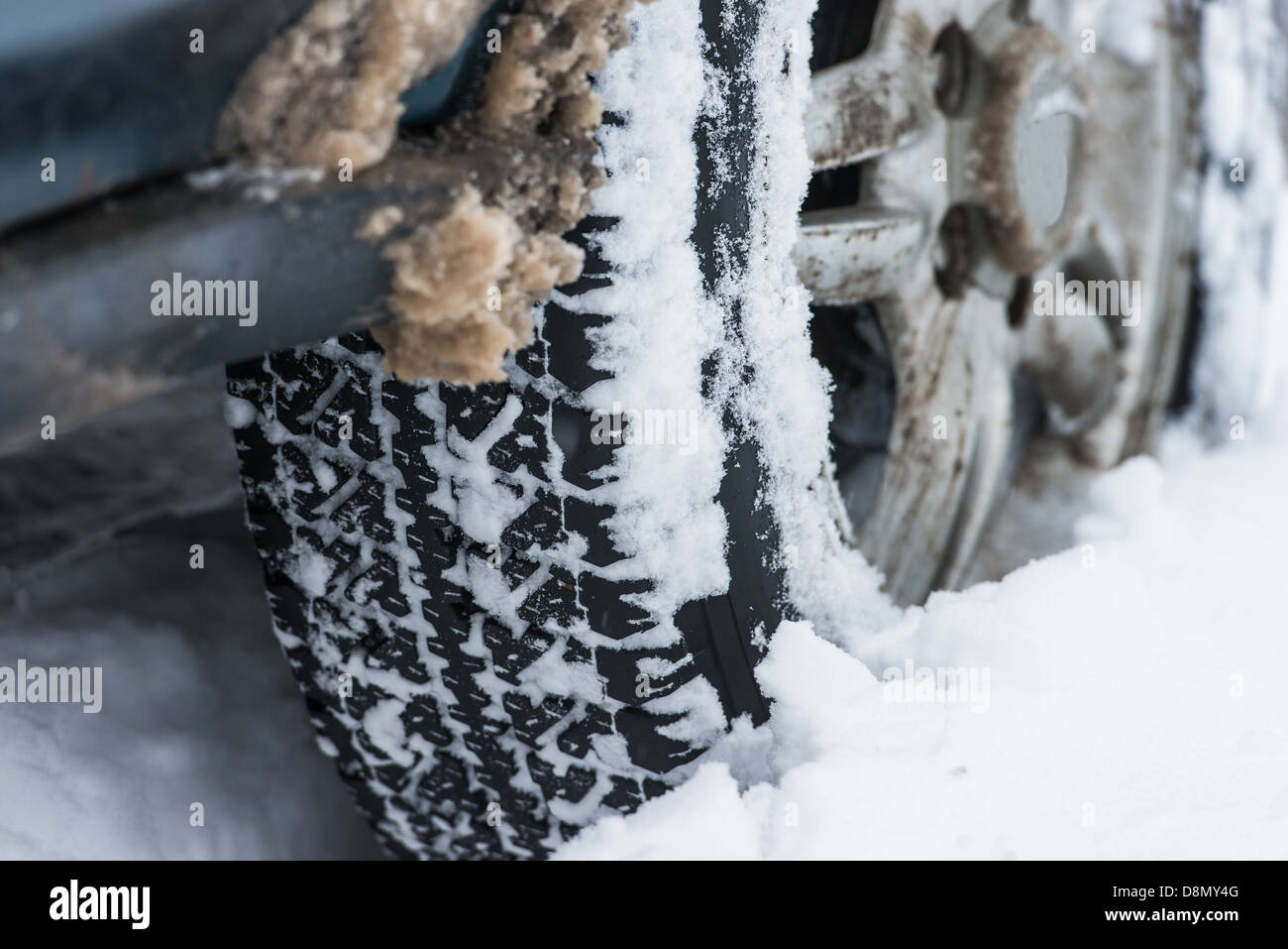 wheel in the snow Stock Photo - Alamy