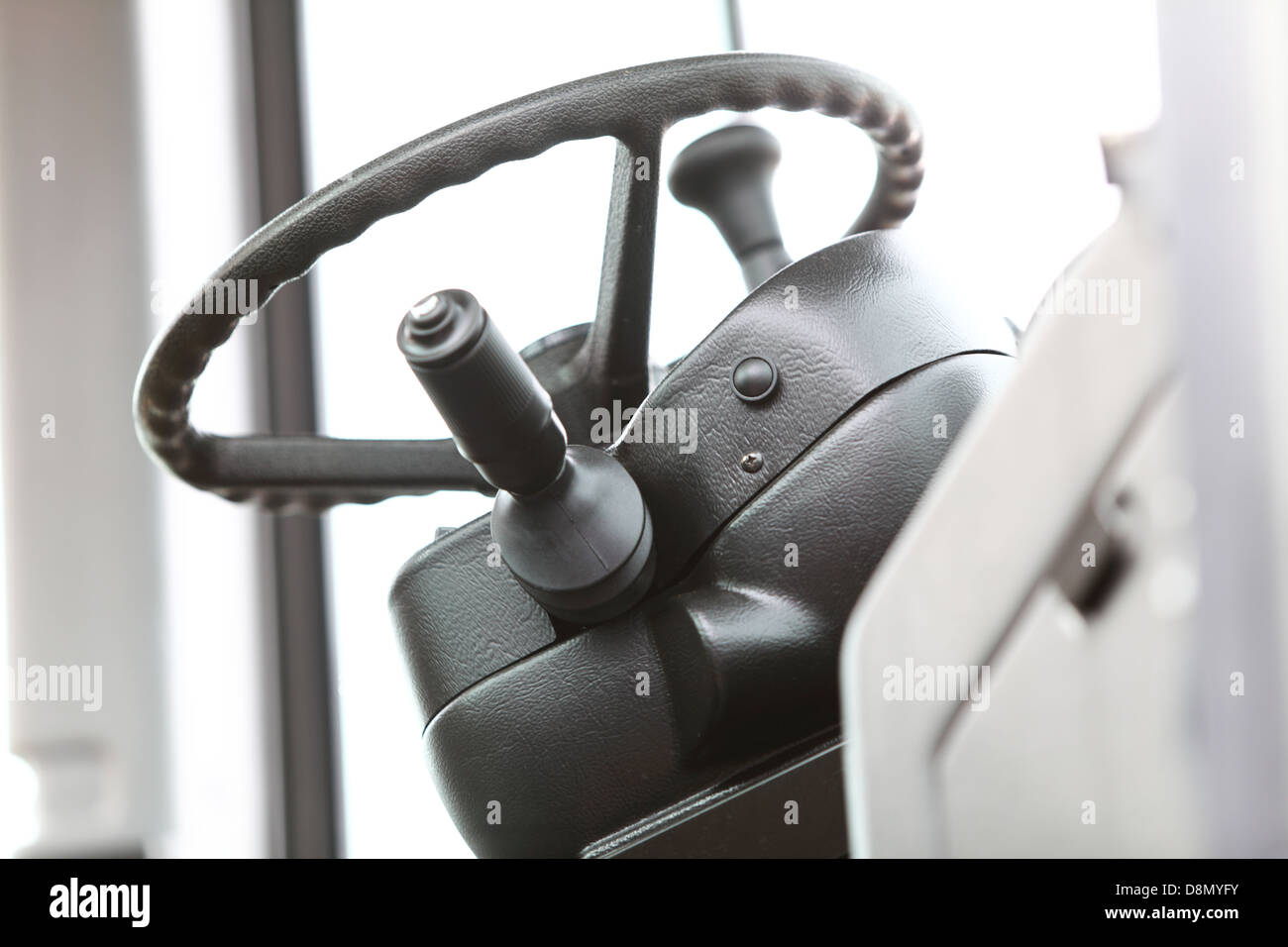 Steering wheel in interior of a new industrial machine Stock Photo - Alamy