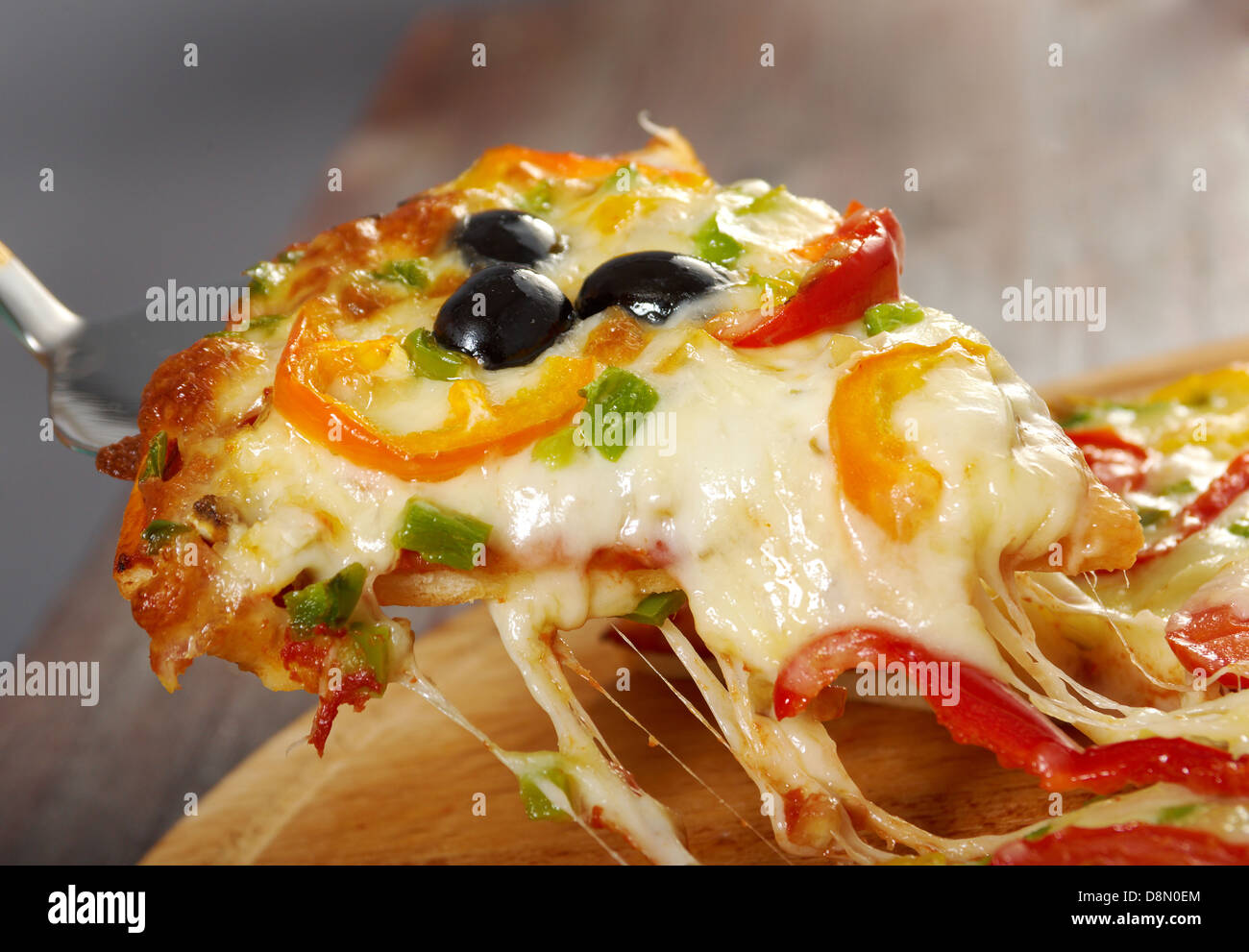 taking slice of pizza,melted cheese dripping Stock Photo - Alamy