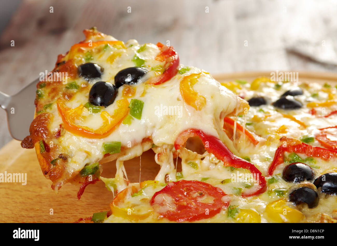 taking slice of pizza,melted cheese dripping Stock Photo - Alamy