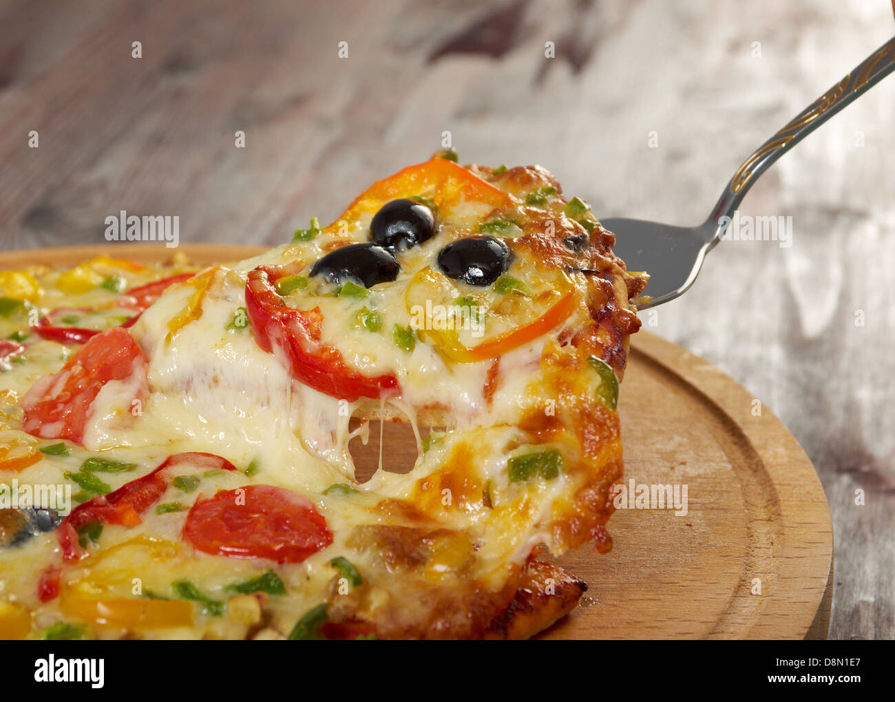 taking slice of pizza,melted cheese dripping Stock Photo - Alamy