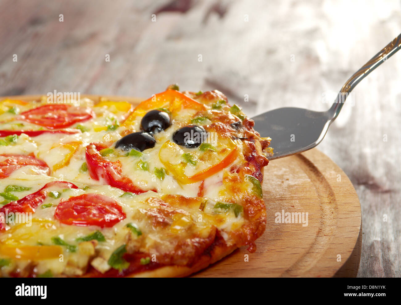 taking slice of pizza,melted cheese dripping Stock Photo - Alamy