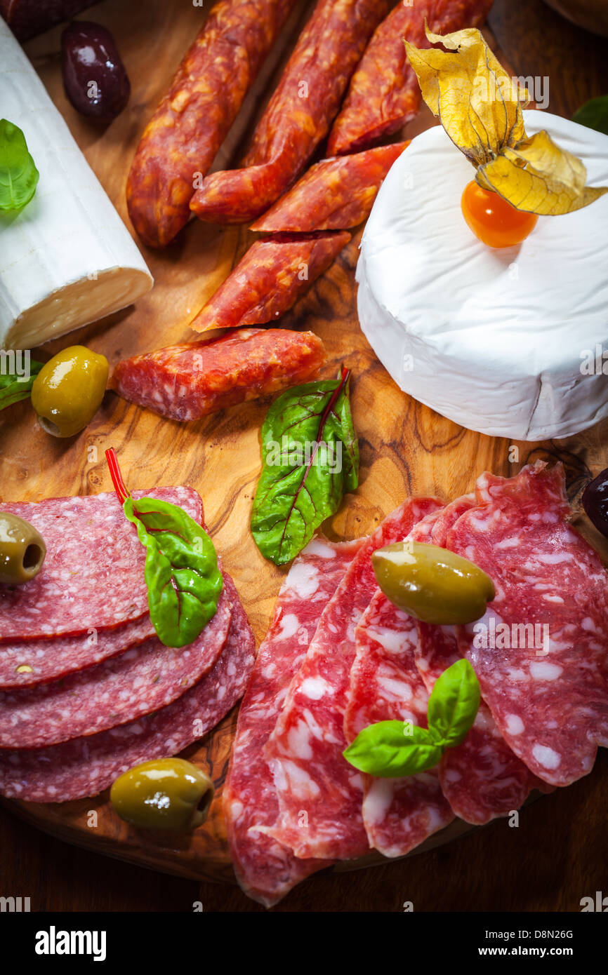 Salami and cheese platter with vegetable and herbs Stock Photo - Alamy