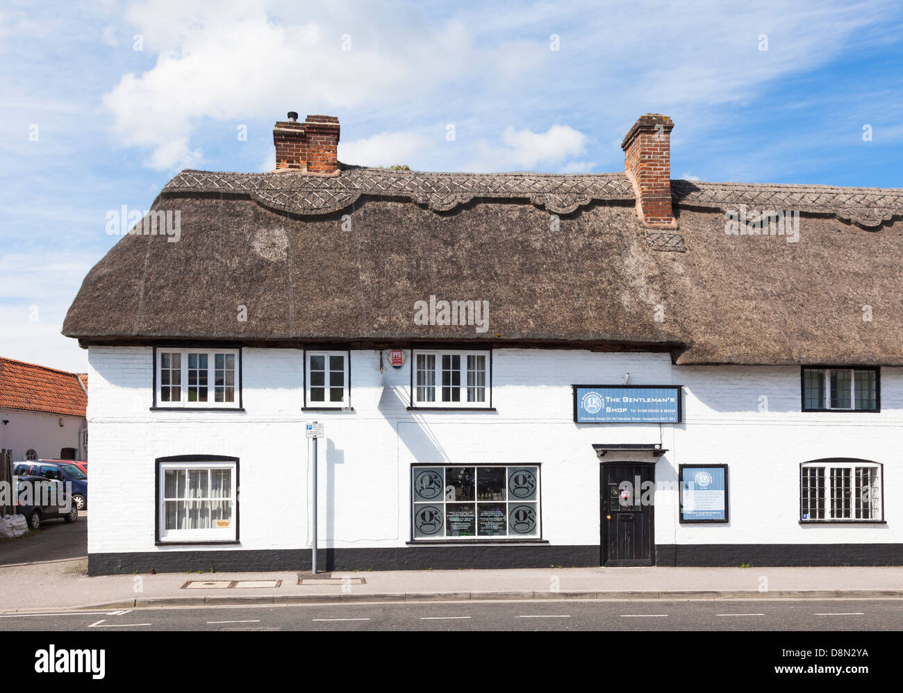 White thatched building used as shops in Hungerford, Berkshire, England ...