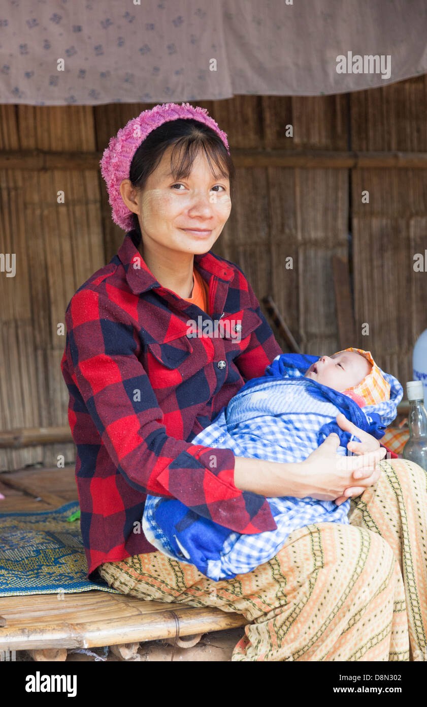 Karen Padong tribeswoman and baby in village near Chiang Rai, northern ...