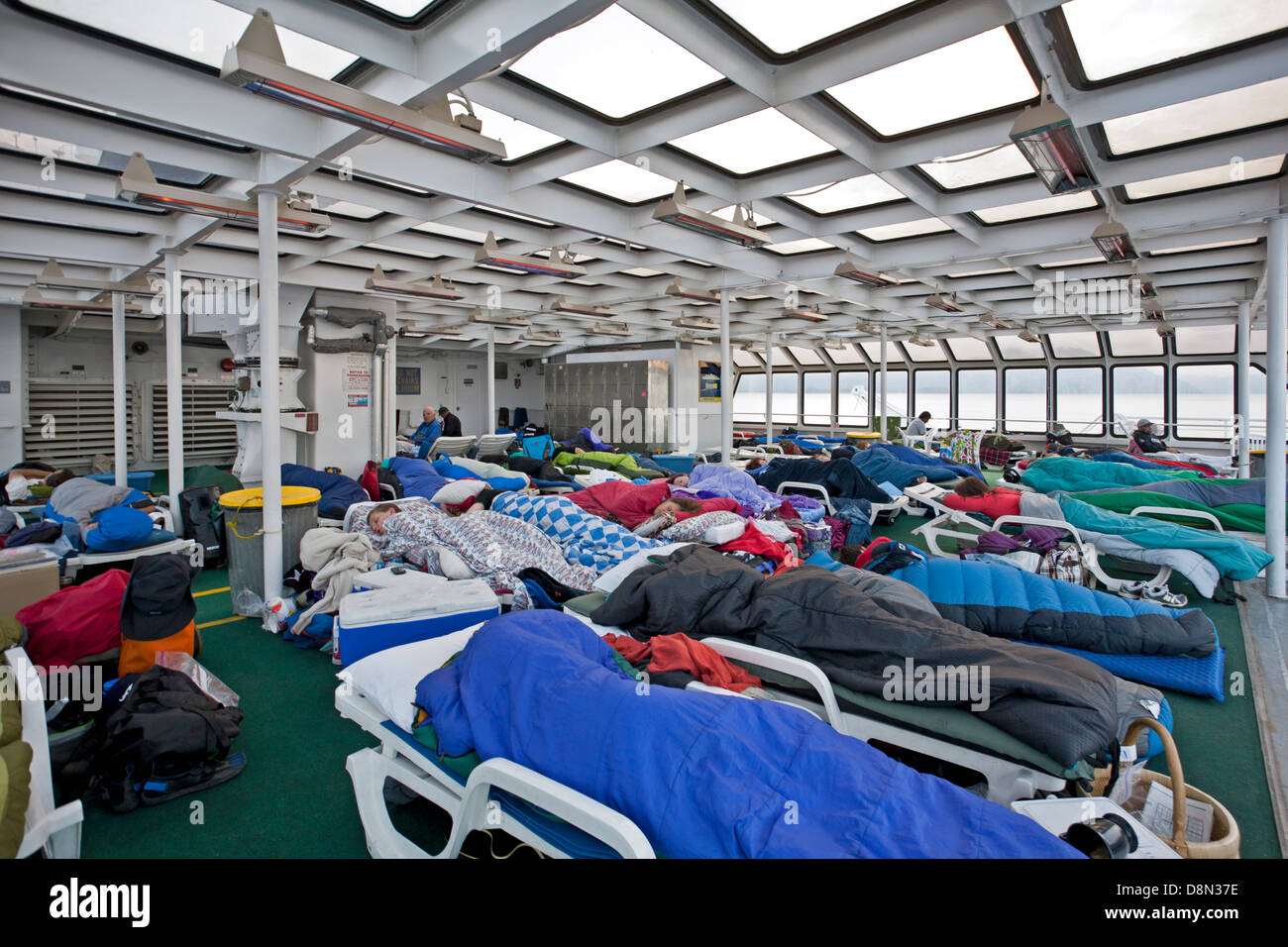 Passengers sleeping on the solarium. Columbia ferry. Inside Passage ...