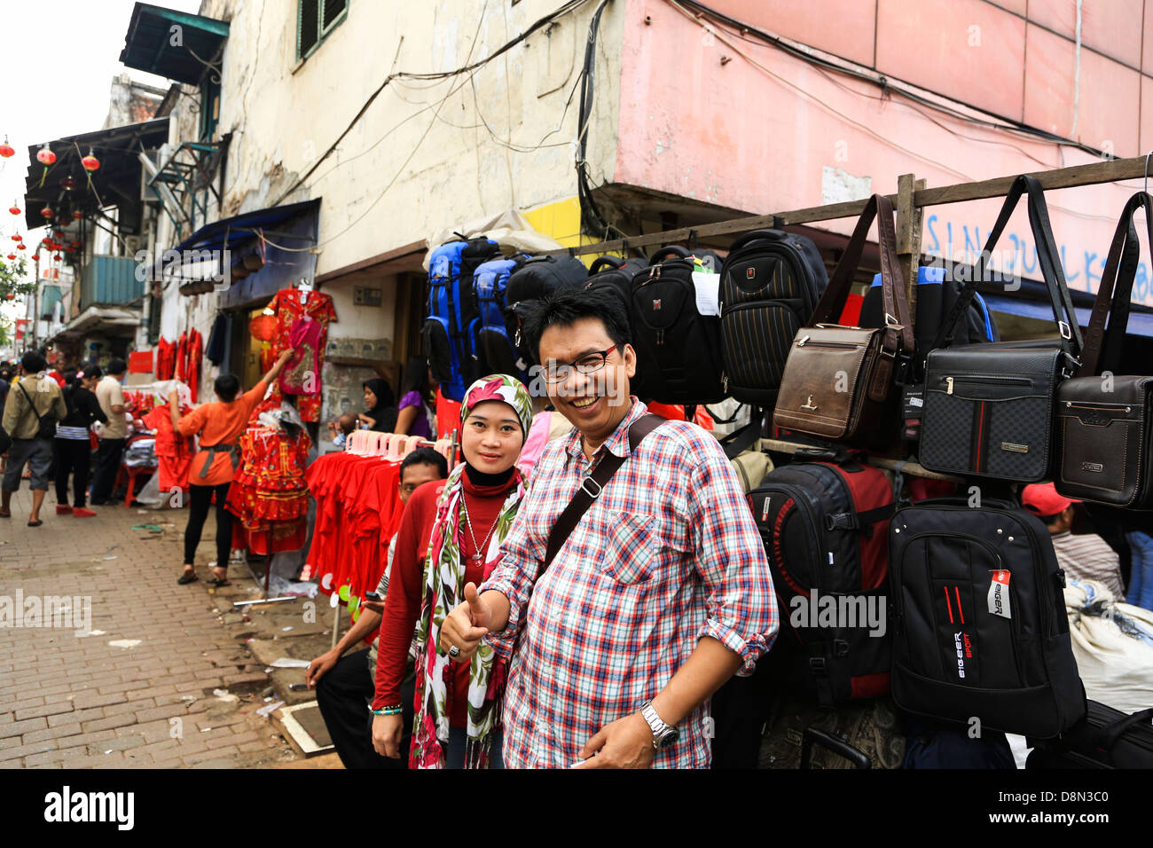 Friendly people in the street of Glodok, the chinatown of Jakarta, the ...