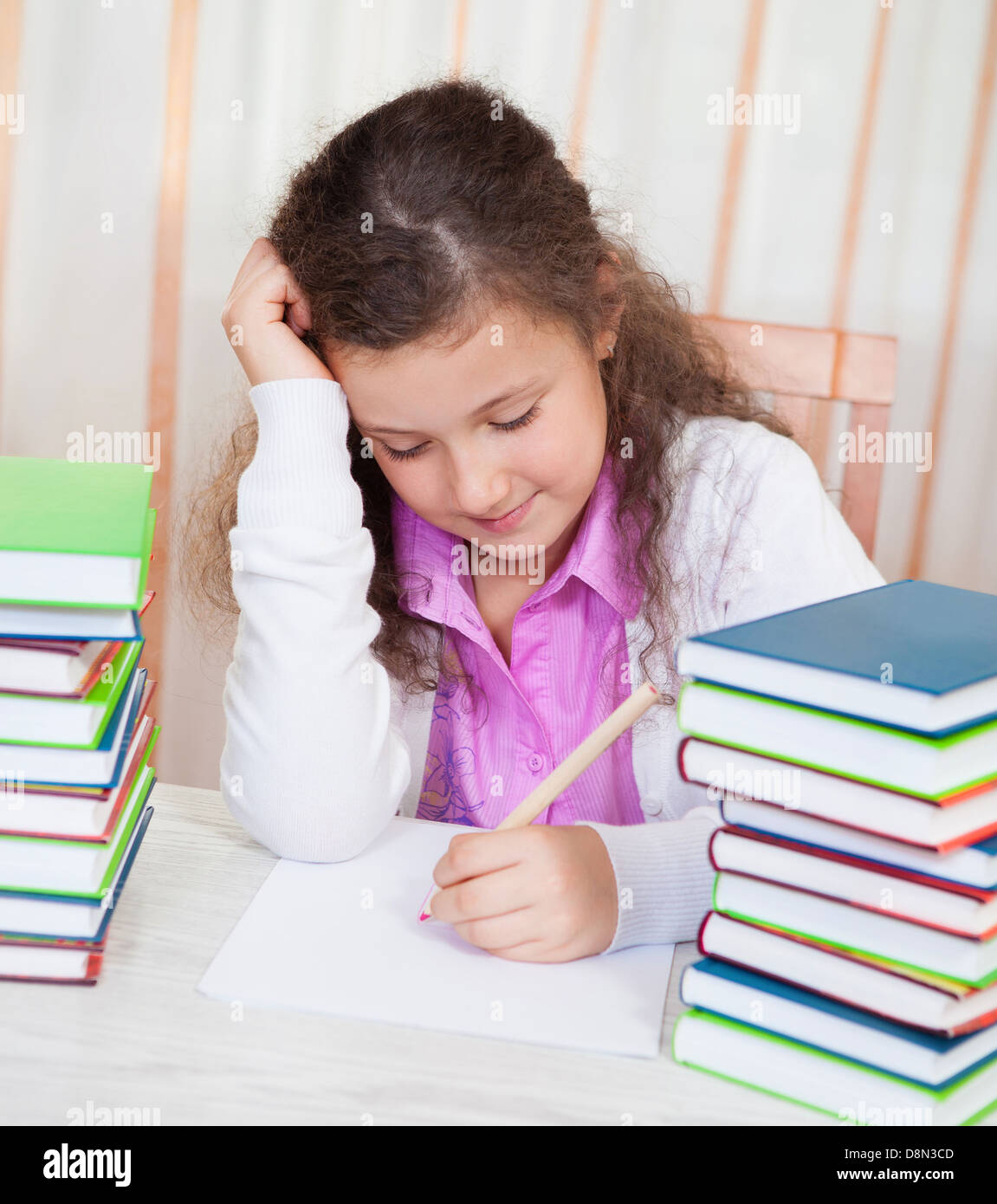 Little girl doing her homework Stock Photo - Alamy