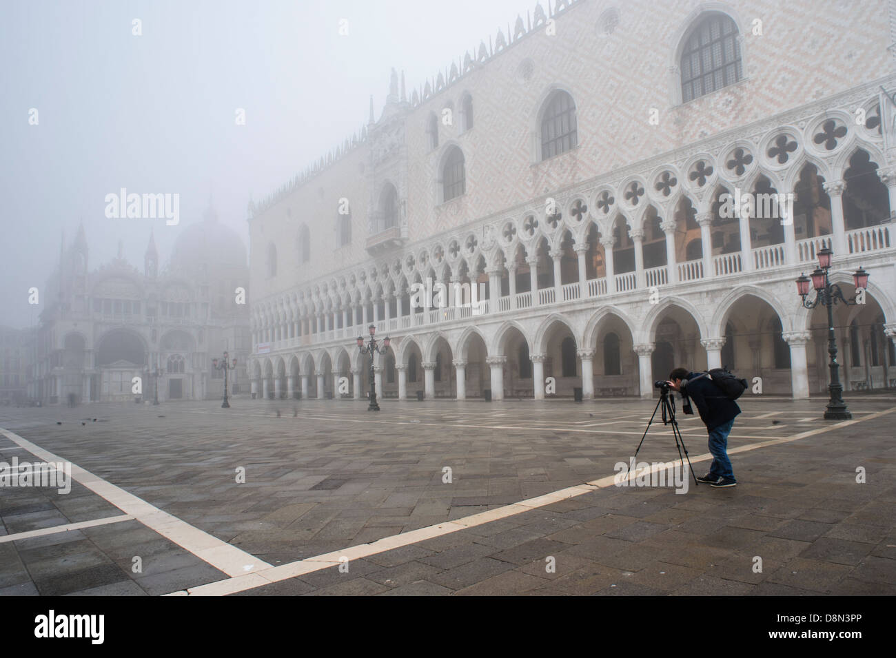 A photographer takes a picture of St. Mark's Square covered in Fog ...