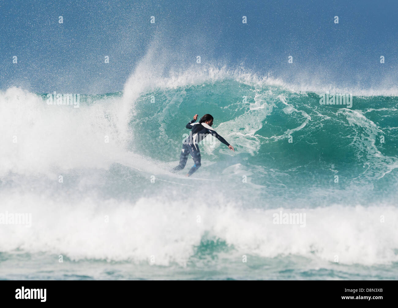 Surfer riding a wave Stock Photo - Alamy