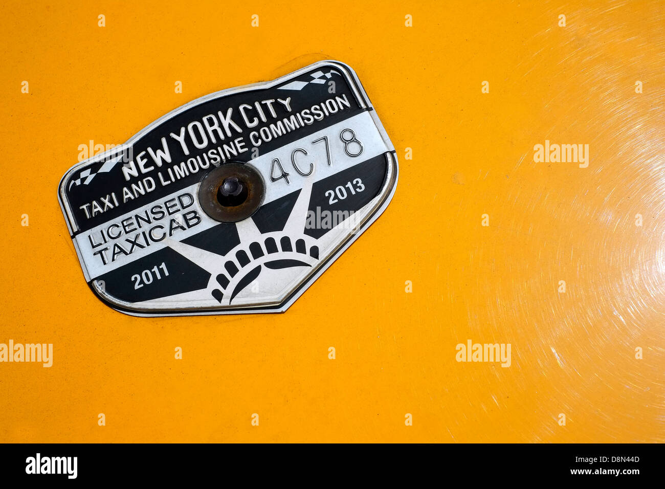 New York City Taxi & Limousine Commission badge on the hood of an NYC ...