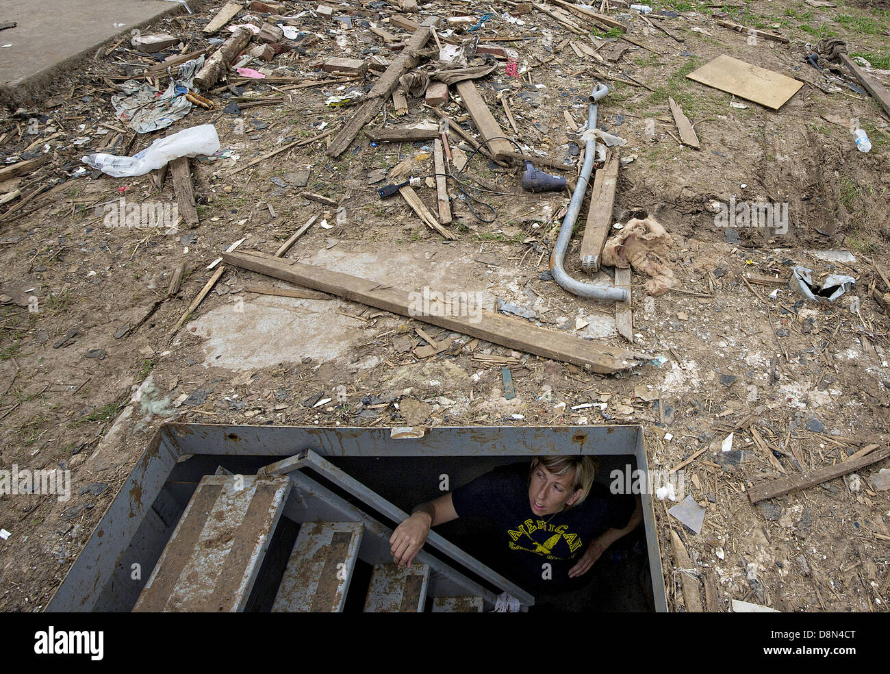Christie England looks out from the storm shelter that saved her life ...