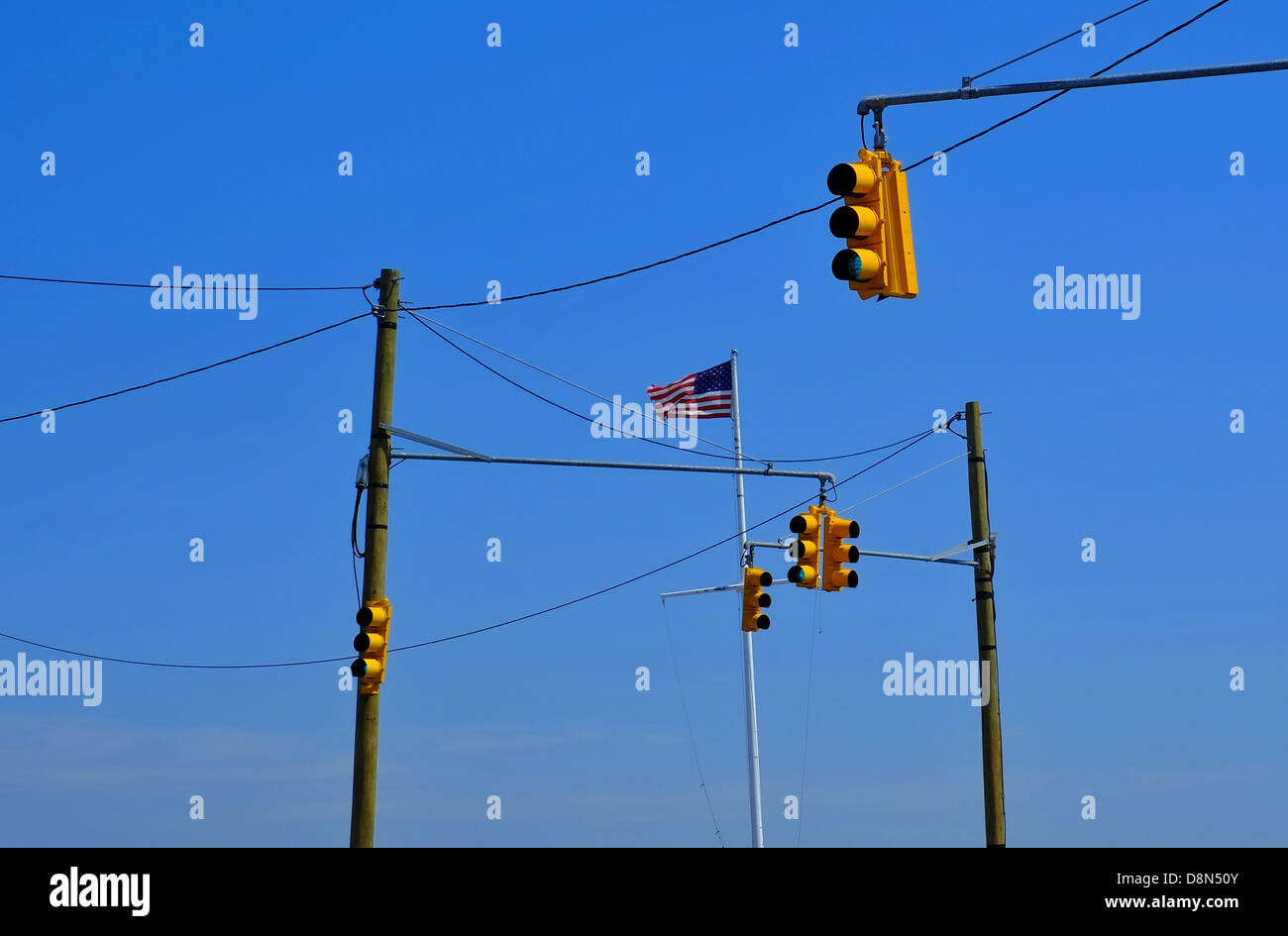 Traffic lights and an American flag at a road intersection in Brooklyn ...