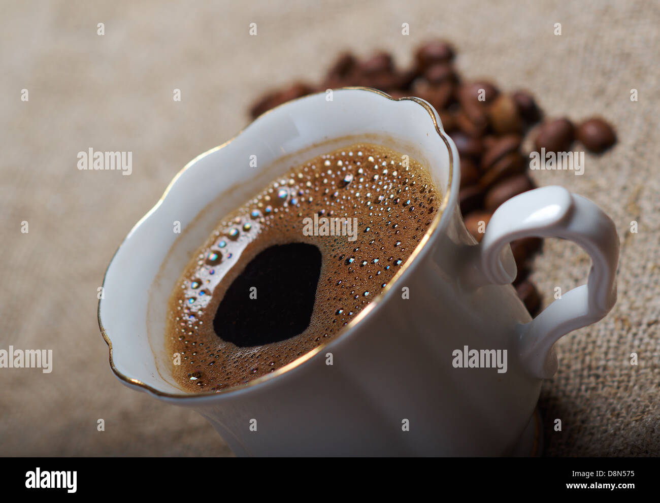 Coffee cup coffee beans background Stock Photo - Alamy