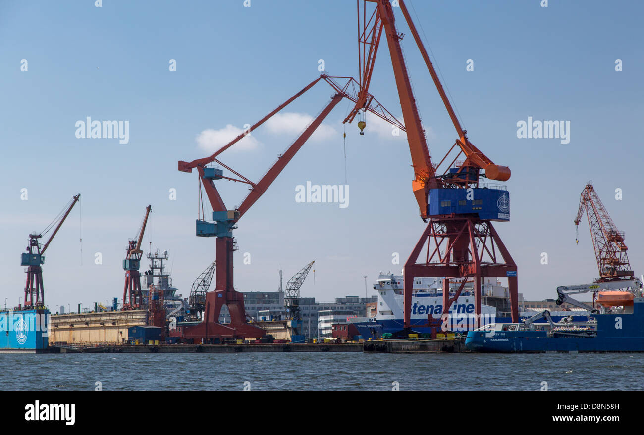 Industrial cranes at a shipyard and floating dry dock in Gothenburg ...