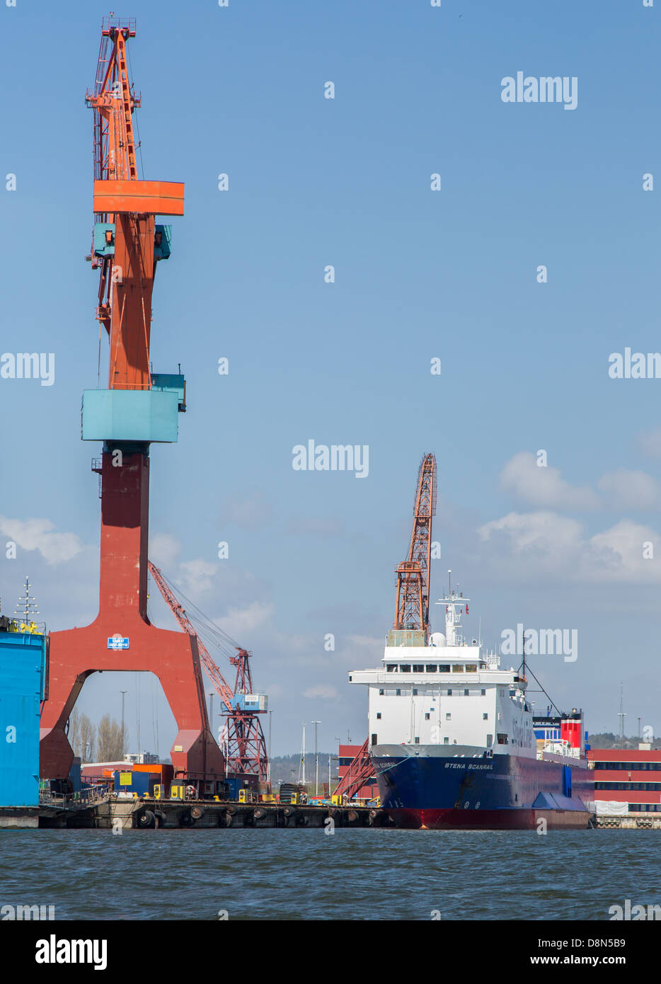 Industrial cranes at a shipyard and floating dry dock in Gothenburg ...