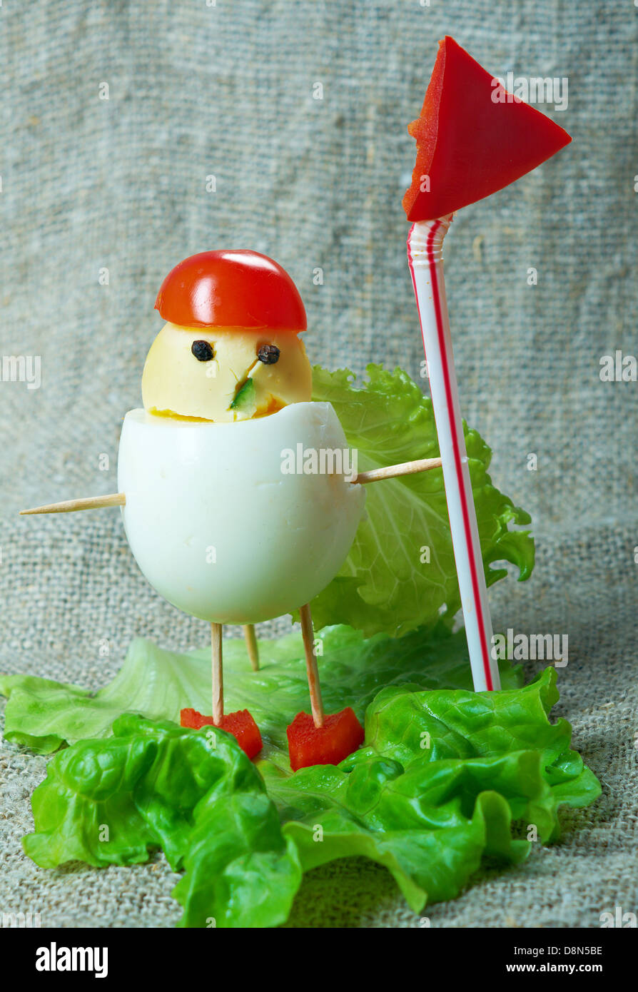child breakfast. soldiermade from eggs, small radish,tomato Stock Photo ...
