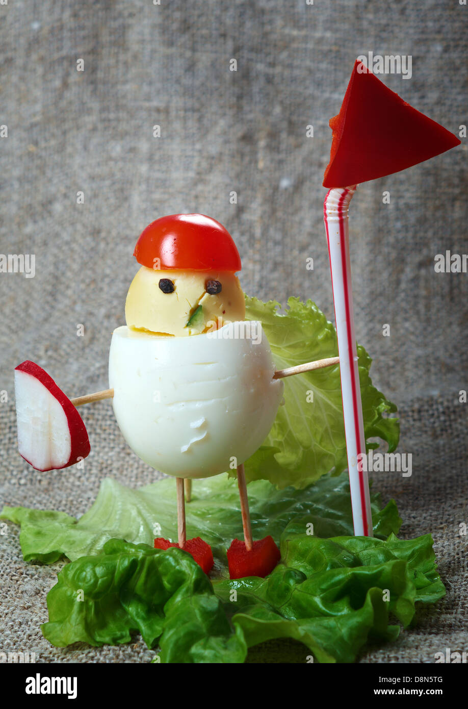 child breakfast. soldiermade from eggs, small radish,tomato Stock Photo ...