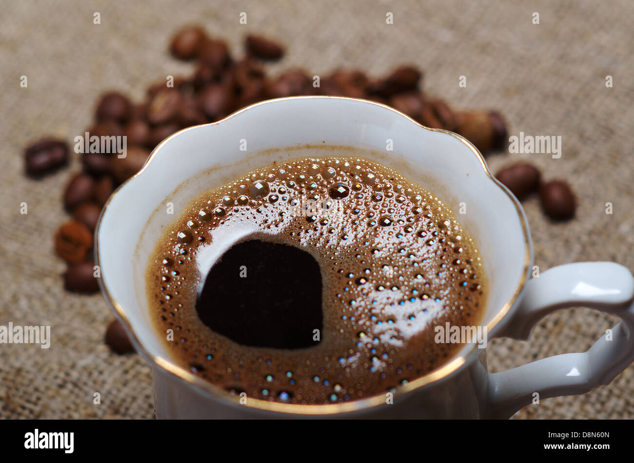 Coffee cup coffee beans background Stock Photo - Alamy