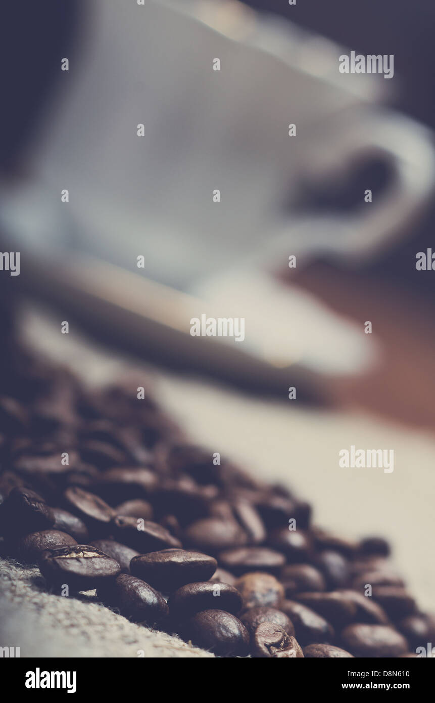 Coffee cup coffee beans background Stock Photo - Alamy