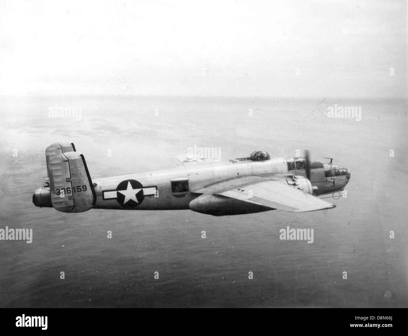 A World War II-era aircraft flying on a mission, capturing the essence ...