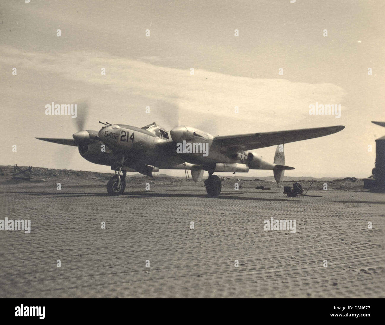 A World War II-era aircraft is positioned on the runway, preparing for ...