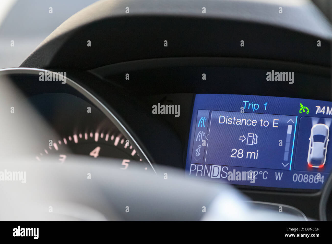 A car cockpit showing fuel stats and lighting Stock Photo - Alamy