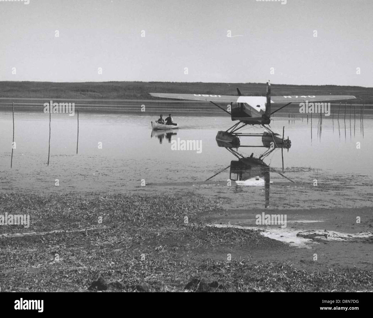 This image depicts a float plane, an aircraft designed to take off and ...