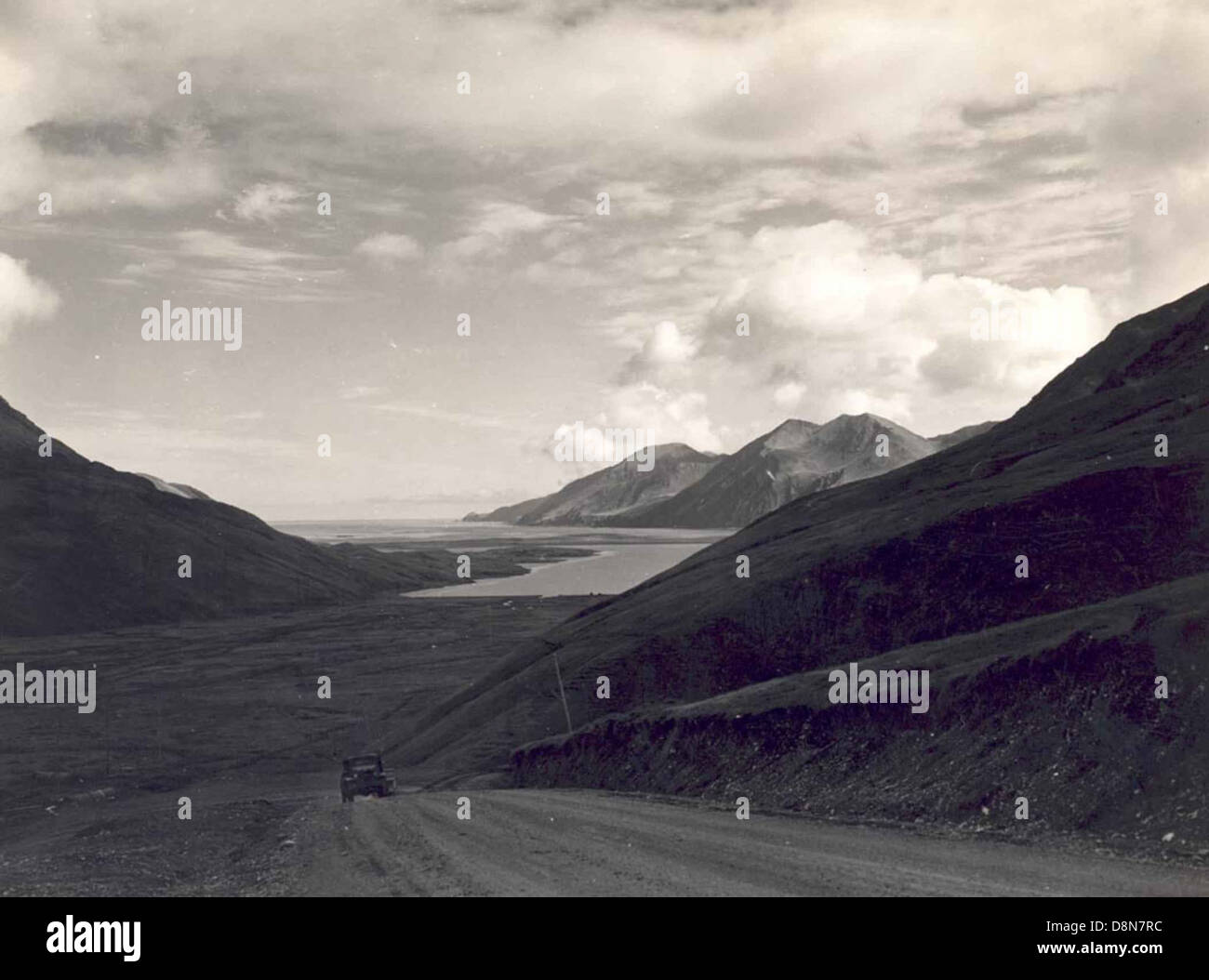 A scenic landscape featuring a vintage road, offering a nostalgic view ...