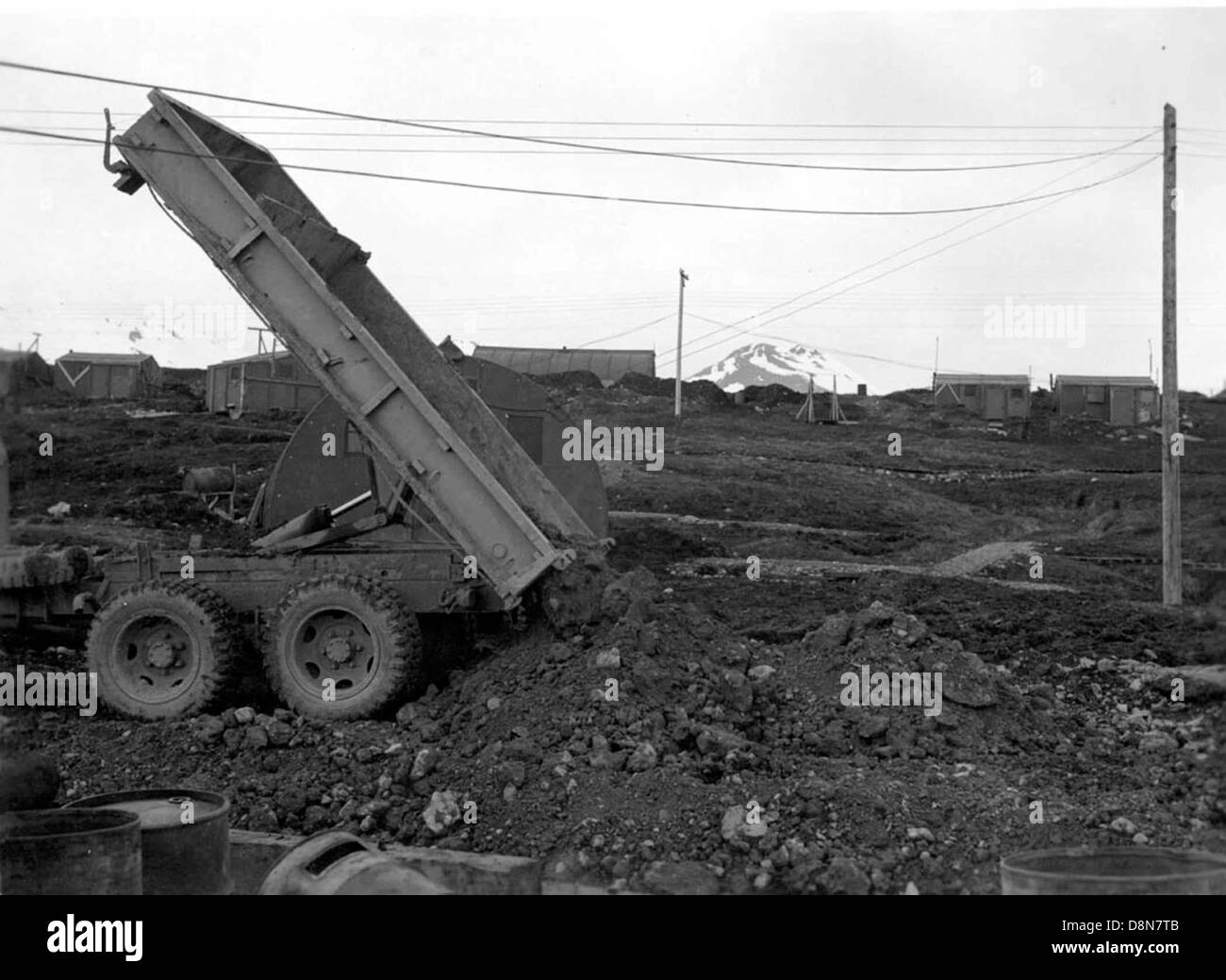 Light transport truck unloading earth Stock Photo - Alamy