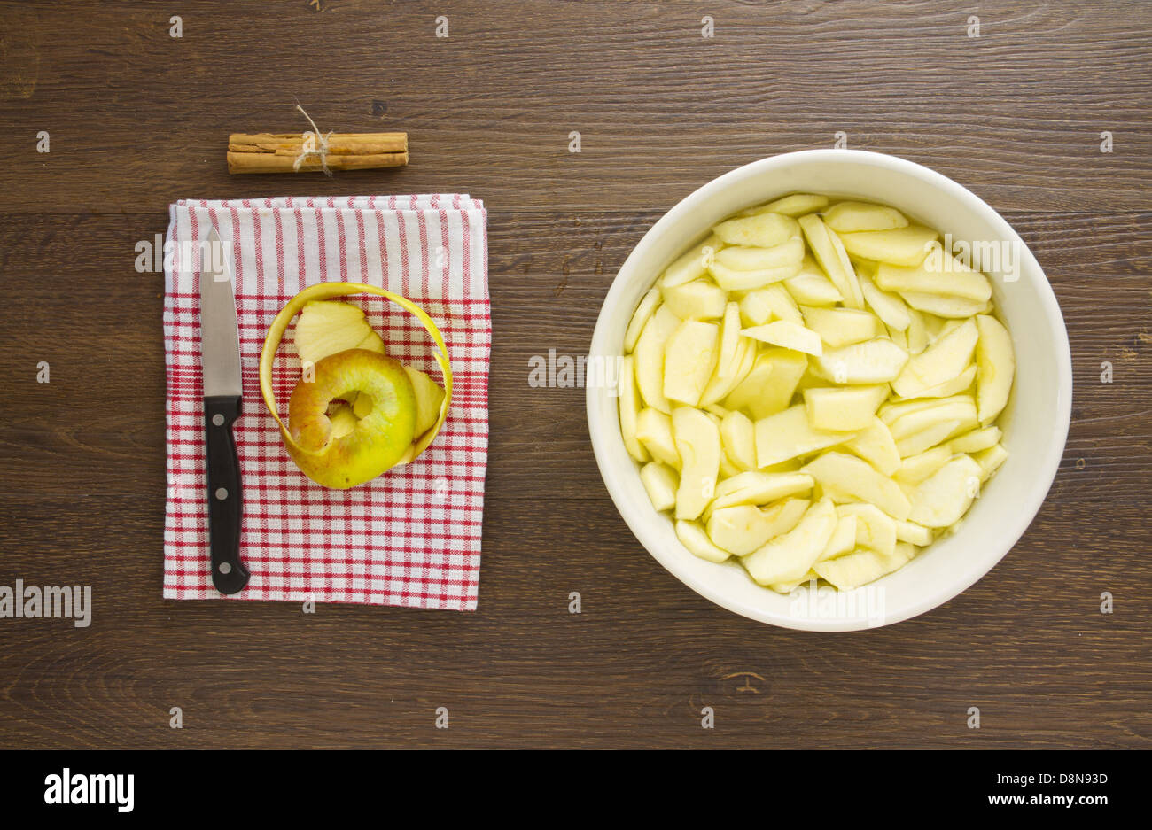 Sliced apples for an apple pie with leftover peel and cinnamon Stock ...