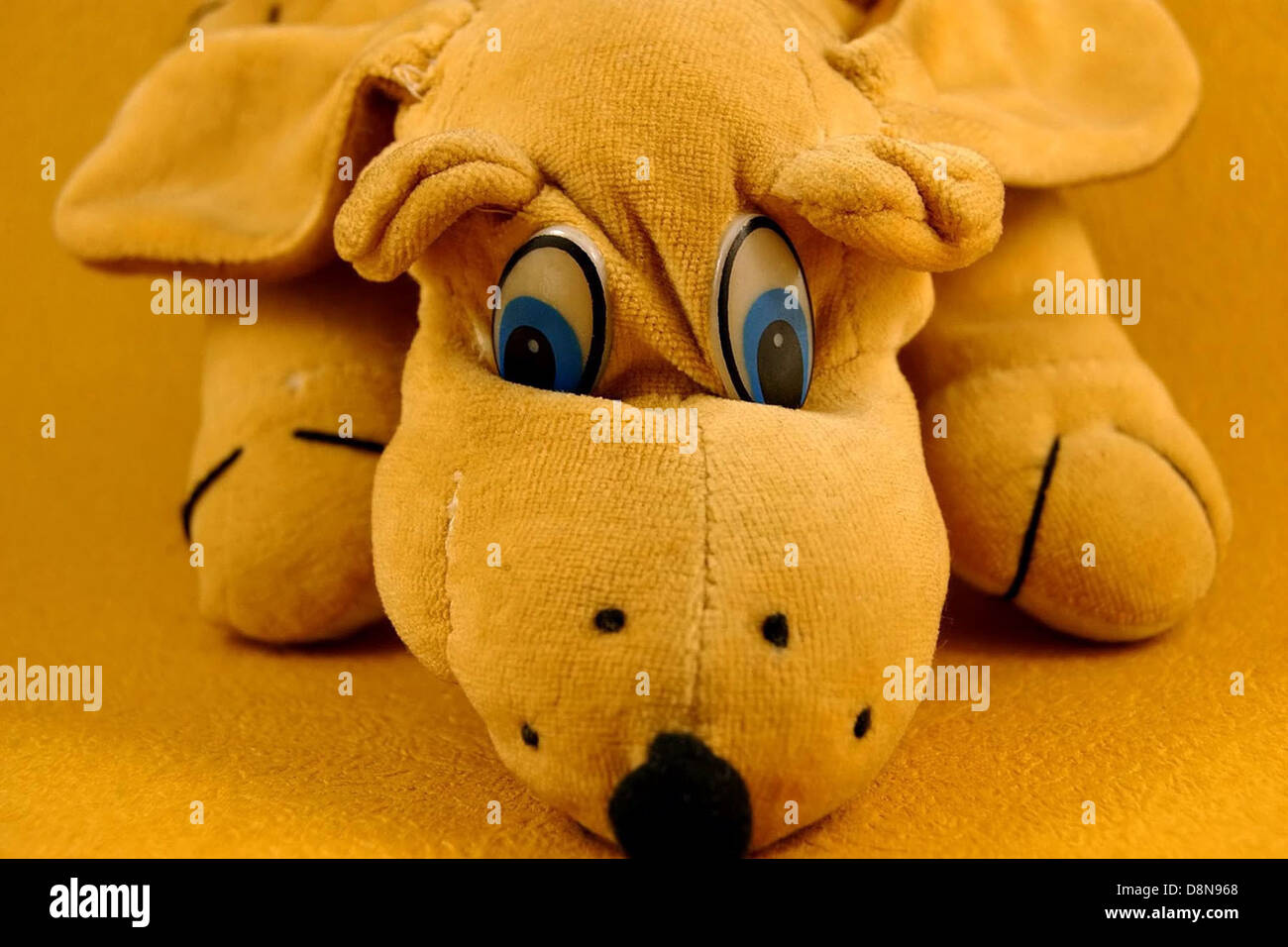 A plush stuffed animal toy, featuring soft fabric and a simple ...