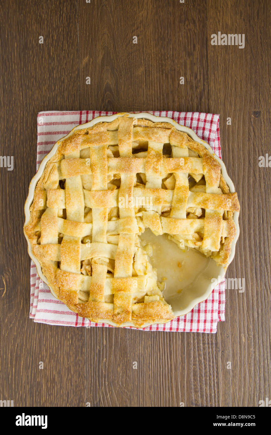 Apple pie with lattice top with slice taken Stock Photo - Alamy