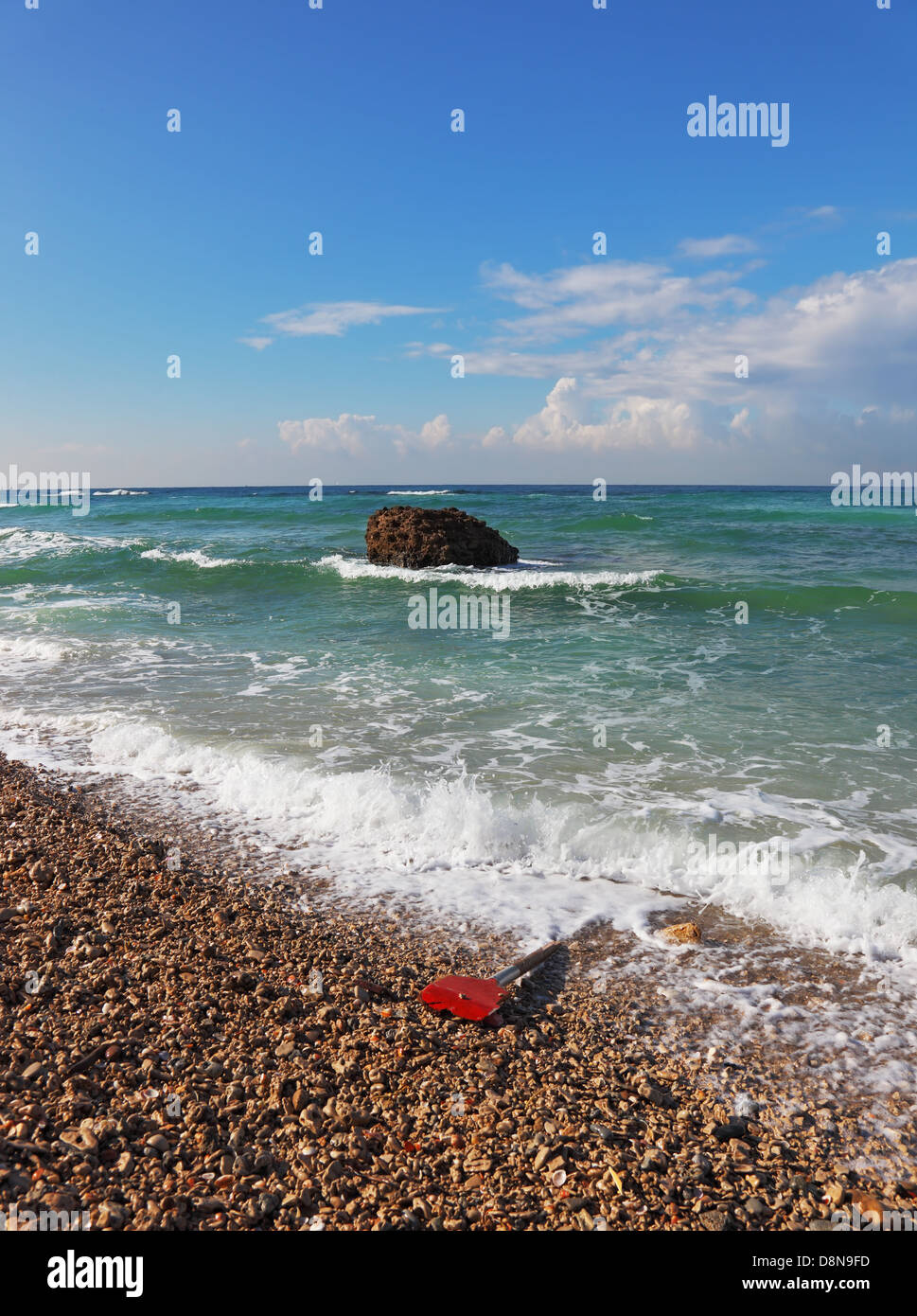 Red chip paddle thrown at beach Stock Photo - Alamy