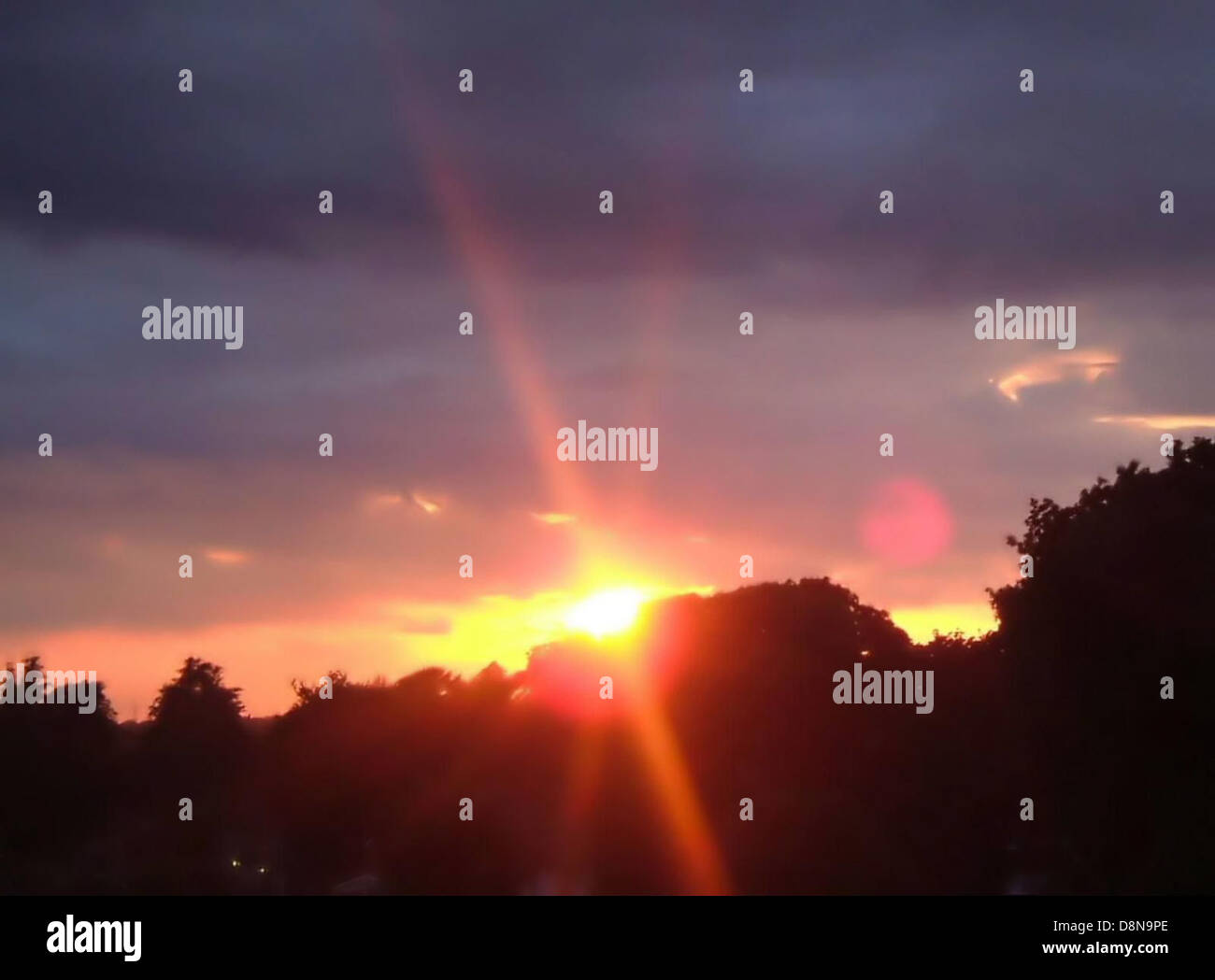 A sunset scene is captured, showing the sun descending below the ...