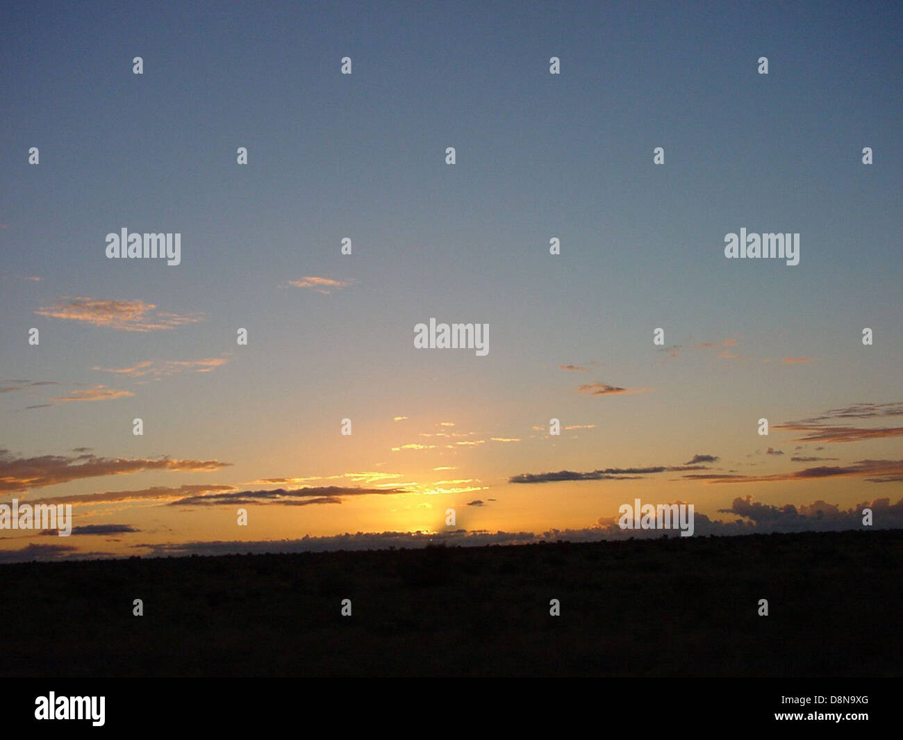 A beautiful sunset scene with vibrant colors filling the sky. The warm ...
