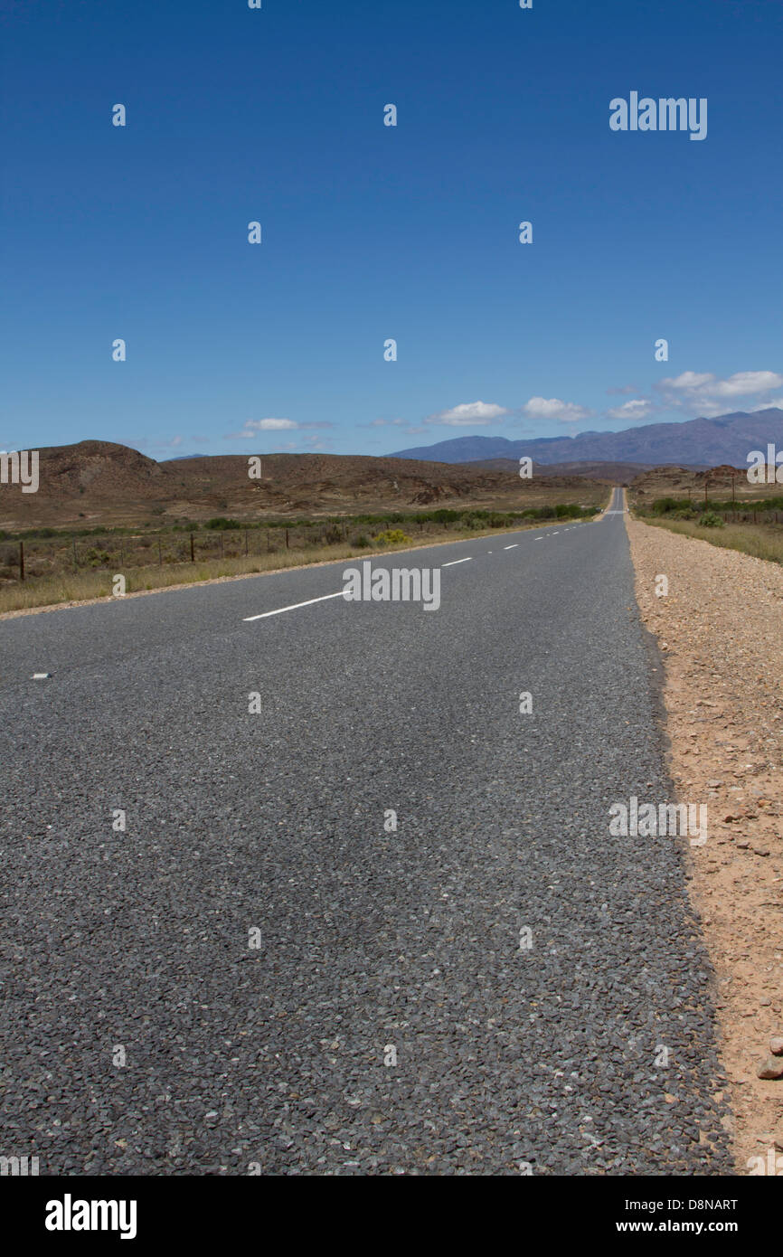 Portrait of a long straight road Stock Photo - Alamy