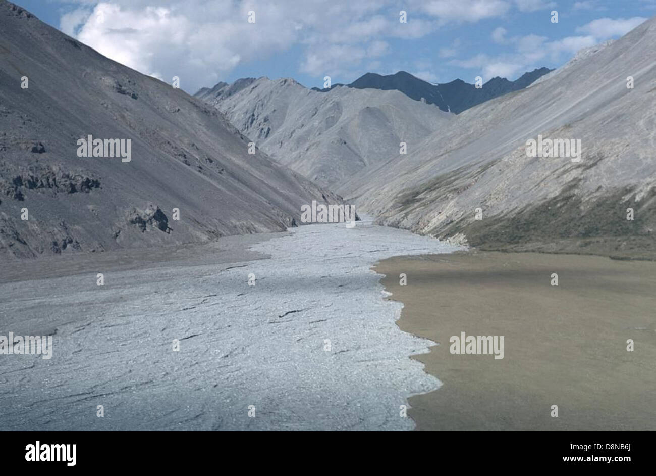 The Chandalar River winds through the rugged mountains, offering a ...