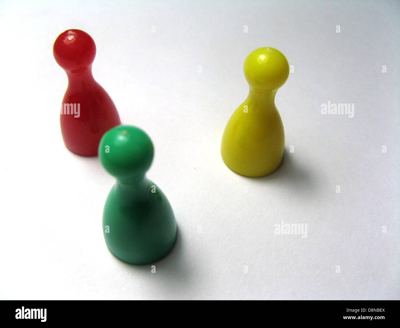 This image shows three figures standing or sitting together in a ...