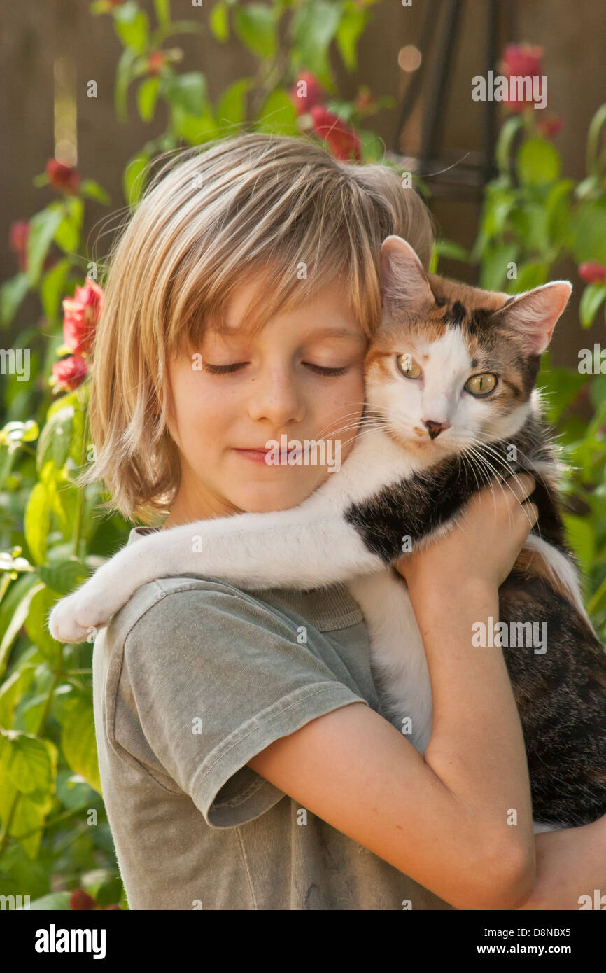 Boy hugs cat hi-res stock photography and images - Alamy