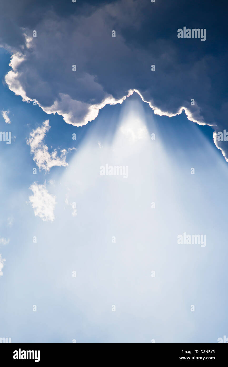 Sun light streaming from clouds Stock Photo - Alamy