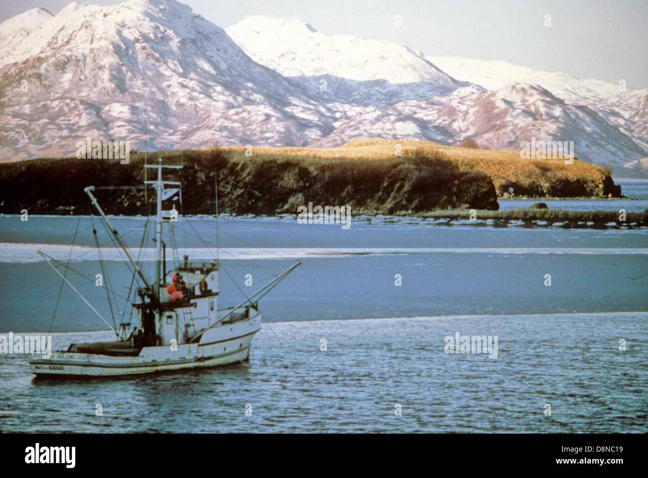 A boat used for transportation moves across the water, providing a ...