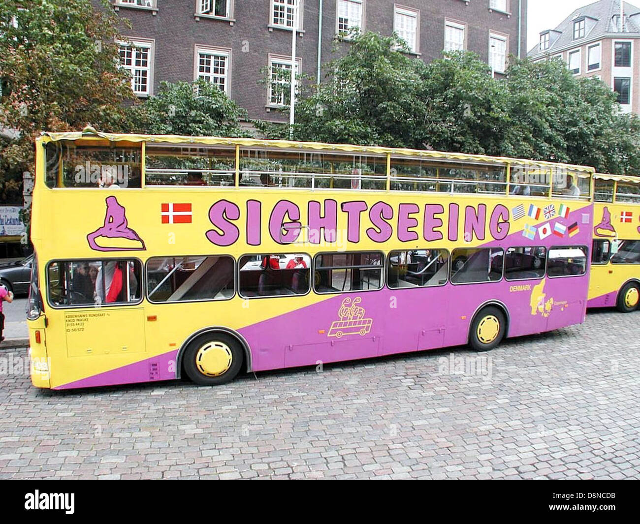 This image shows a trip bus, commonly used for group travel, parked or ...